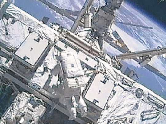 Astronauts step into history books in last spacewalk