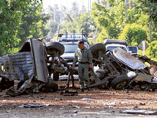 Ambush and bombs kill two, wound 12 in Thailand's south