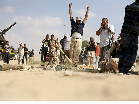 Libya's revolutionary forces capture senior Gaddafi general, NTC ...