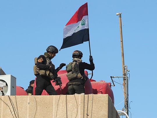 Iraqi forces raise flag above government complex in Ramadi