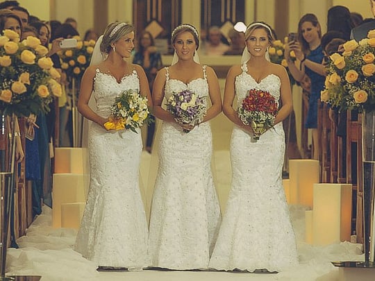 Identical Brazilian triplets say ‘I do’ — together