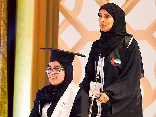 Emirati graduates with daughter