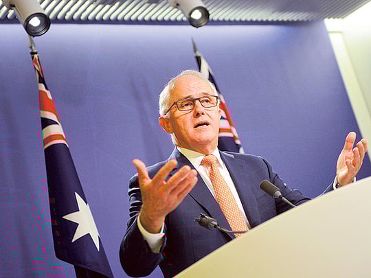 After days of limbo, Australian premier claims election win