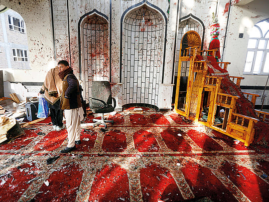 ‘Smell of blood and flesh’ in Kabul mosque hit by suicide bomber