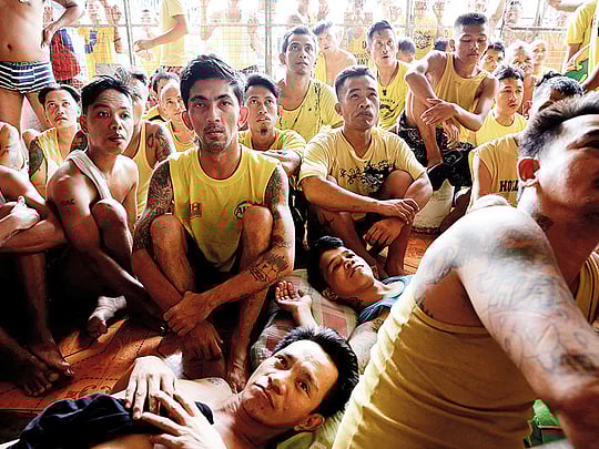 Overturned pail sparks deadly riot at Philippine jail