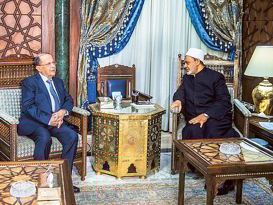 Lebanese president in Egypt, defends Hezbollah’s arms