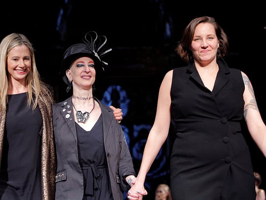Breast cancer survivors model lingerie at NYFW