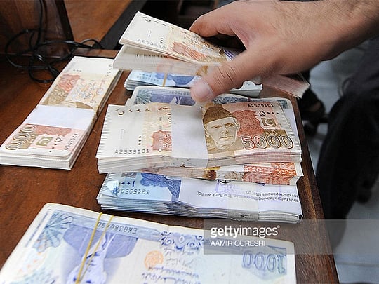 Pakistan rupee drops most in nine years in apparent devaluation