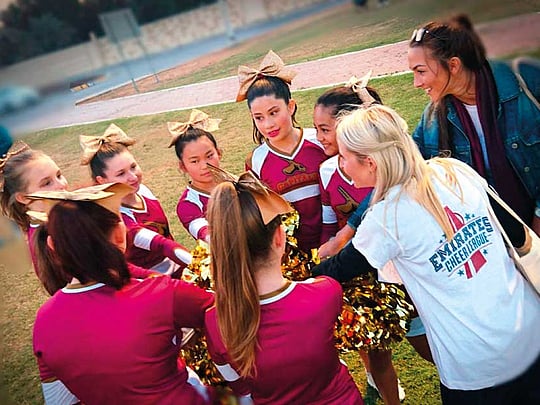 Glitter girls with pompoms make a mark