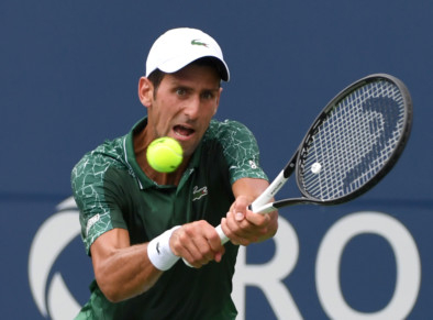 Djokovic and Wawrinka advance in Toronto