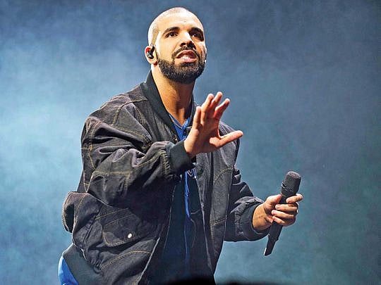 Rapper Drake spotted leaving hotel in a bulldog mask