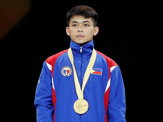 Carlos Edriel Yulo claims Philippines' first-ever gold at the FIG ...