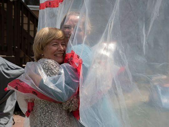 ‘Hug glove’ gives Canada family bit of normalcy during coronavirus pandemic