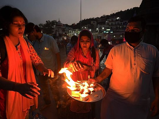 India: Pilgrims trickle back to the Ganges as lockdown eases