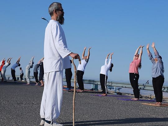 Photos: Kurdish men and women practise yoga on Mount Azmar in Iraq