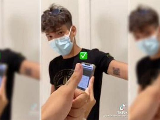 Scan here: Italian tattoos COVID-19 vaccine pass on arm