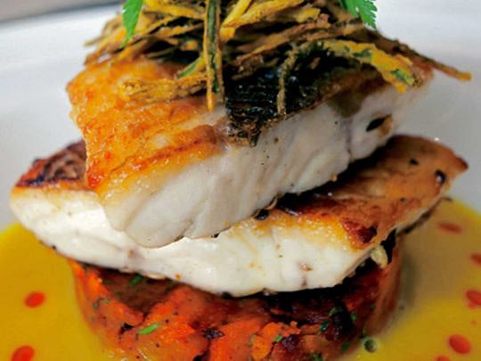 Spice-crusted sea bass, tandoori crushed potatoes, coconut moilee ...