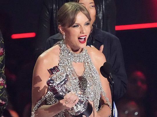 Taylor Swift wins top MTV video award, announces new album