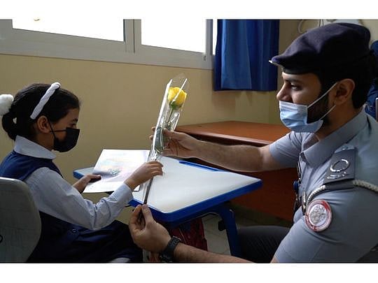 Watch: Abu Dhabi Police greet children with bouquets on first day of ...