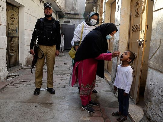 Pakistan says gunmen killed policeman guarding polio workers