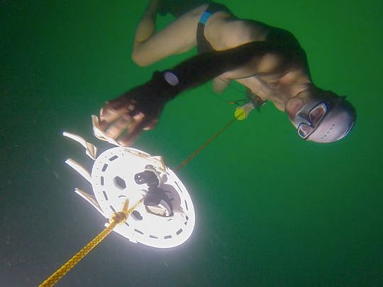 Free-diver David Vencl plunges to record depths in frozen Swiss lake