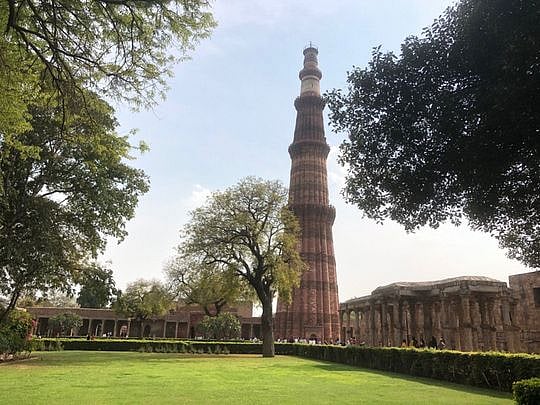 Qutub Minar stands tall amidst the ruins of a great ancient city of Delhi