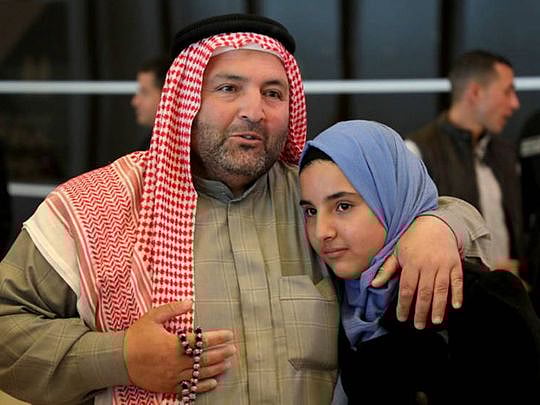 Syrian father and daughter reunite after 10-year separation at Amman ...