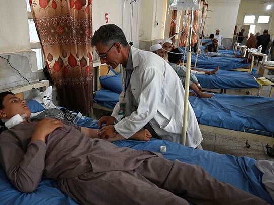 Death toll in Pakistan suicide bombing rises to 54 as families hold ...