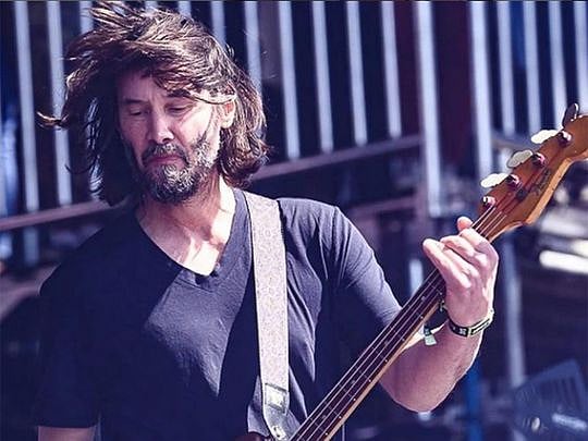 Hollywood actor Keanu Reeves stuns on his bass guitar at Los Angeles ...