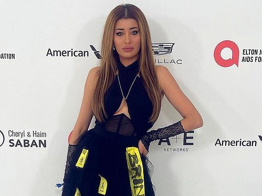 Former Miss Iraq stirs controversy with dress featuring names of ...