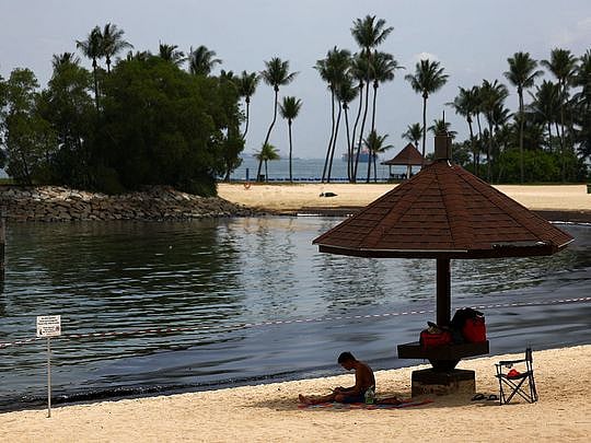Beaches on Singapore's Sentosa island closed after oil spill