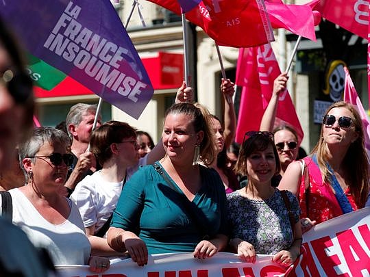 French feminists protest Le Pen even as she pulls in women