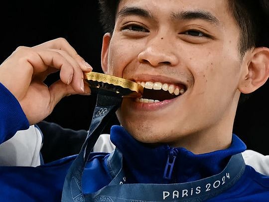 ‘Overwhelmed’ Yulo wins historic gymnastics Olympic gold for Philippines