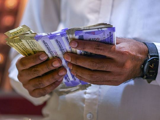 Indian rupee slips to 85 against dollar for first time in big boost for ...