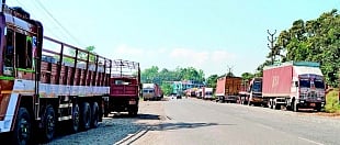 Haphazard parking of heavy vehicles on widened road a nightmare for ...