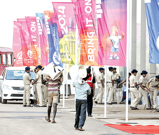 WORKERS BRING IT ON: Workers carry commodes to the stadium at Bambolim ...
