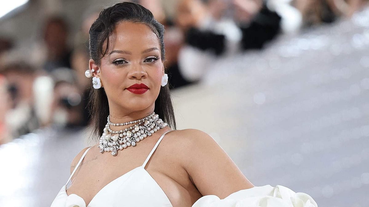 Rihanna flaunts her baby bump in men's fashion campaign, calls it ...