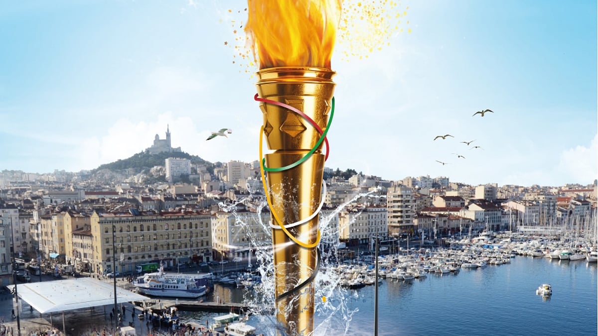 The Olympic torch is being welcomed in French port city of Marseille ...