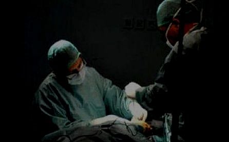 UP doctor stitches up patient under mobile torchlight