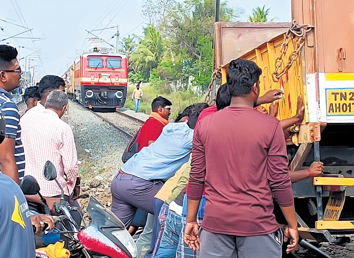 Truck stuck on tracks, alert staff stop mishap