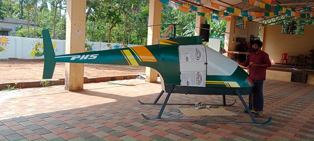 12-feet helicopter with spinning propellers to greet students in ...