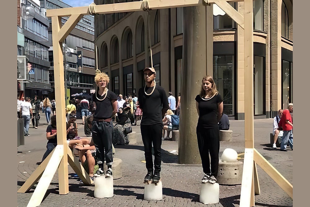 Germany: Students Stand On Ice With Noose Around Necks To Draw ...