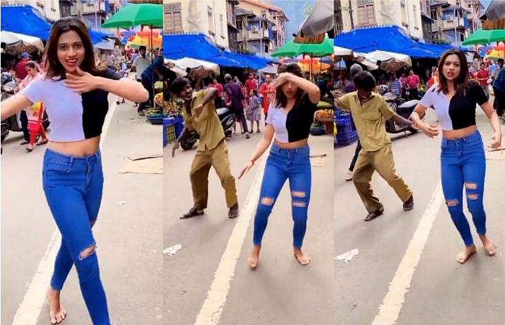 a man trying to imitate a woman's dance moves on street viral