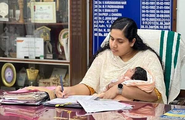 mayor arya rajendran viral photo in office with new born baby