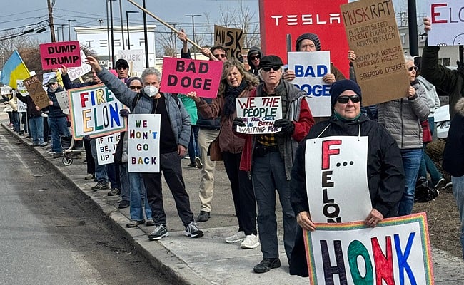 Protests against Elon Musk hit Tesla stores across US