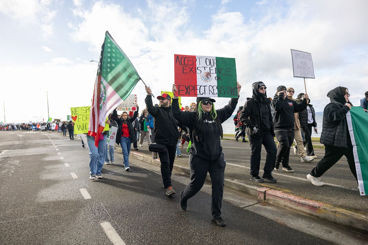 Hundreds Brave Cold at Alki Beach to Protest ICE and Trump's ...