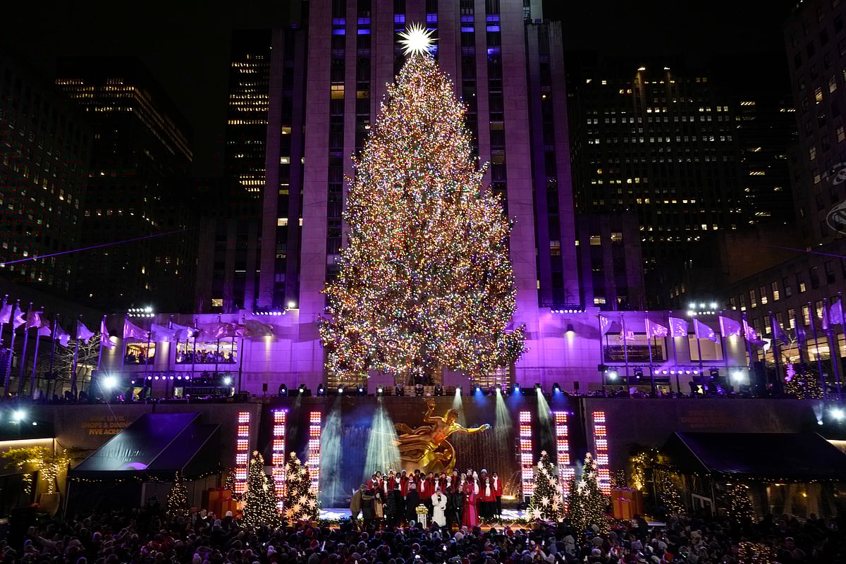 Iconic Christmas tree at Rockefeller Center illuminated in midst of pro ...