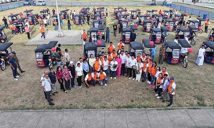 Guv leads distribution of tricycles to villages