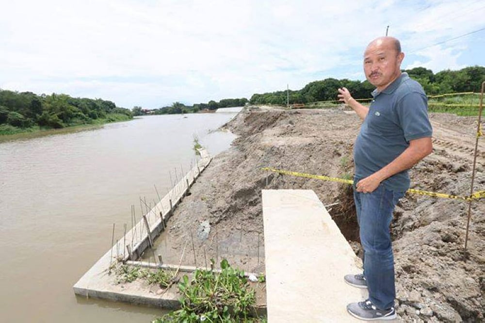 Riverbank flood protection structure collapses