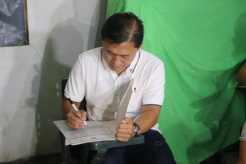 Bong Go arrives in a motorcycle